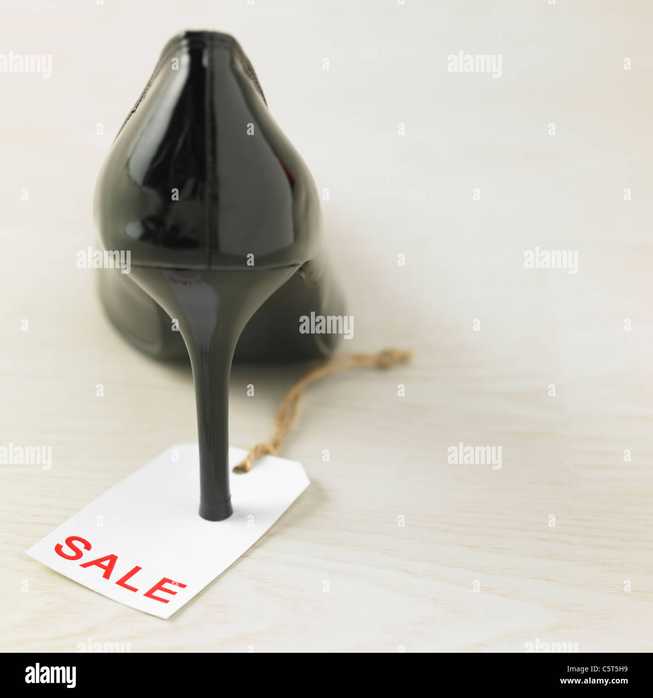 An high heel with sales tag Stock Photo - Alamy