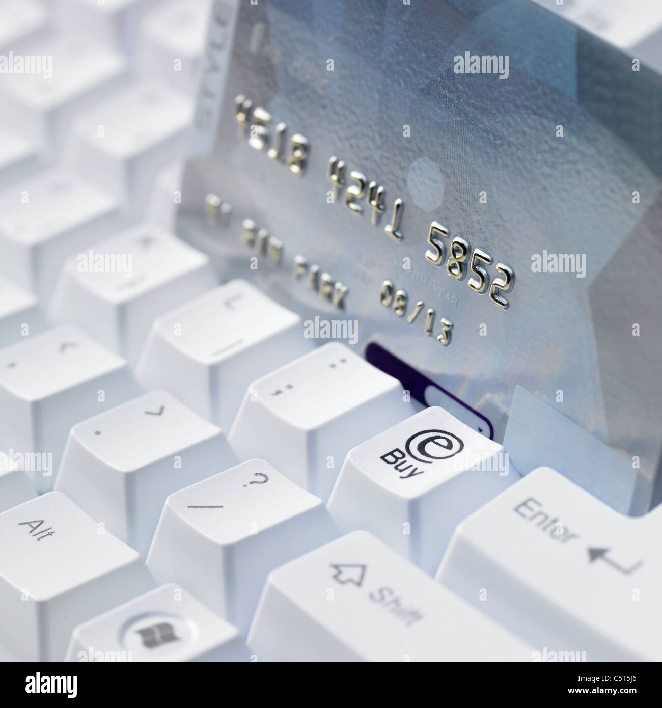 A credit card on a keyboard Stock Photo - Alamy