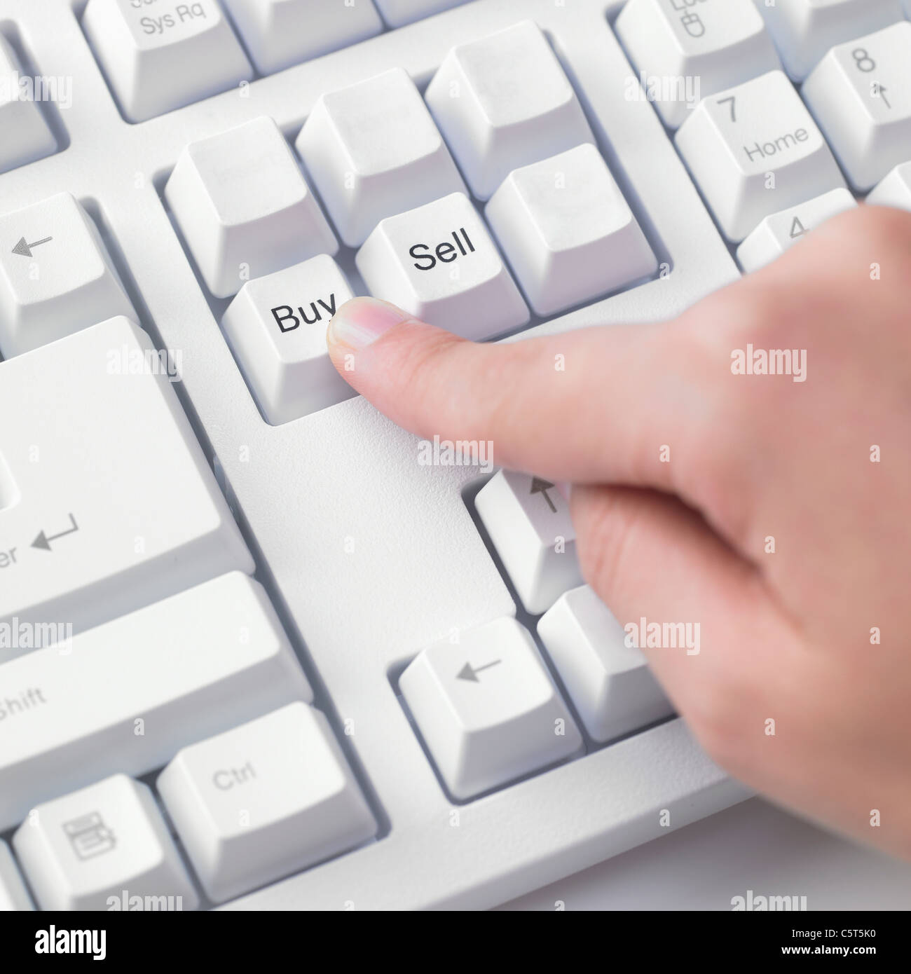 A person pushing a key in a keyboard Stock Photo - Alamy