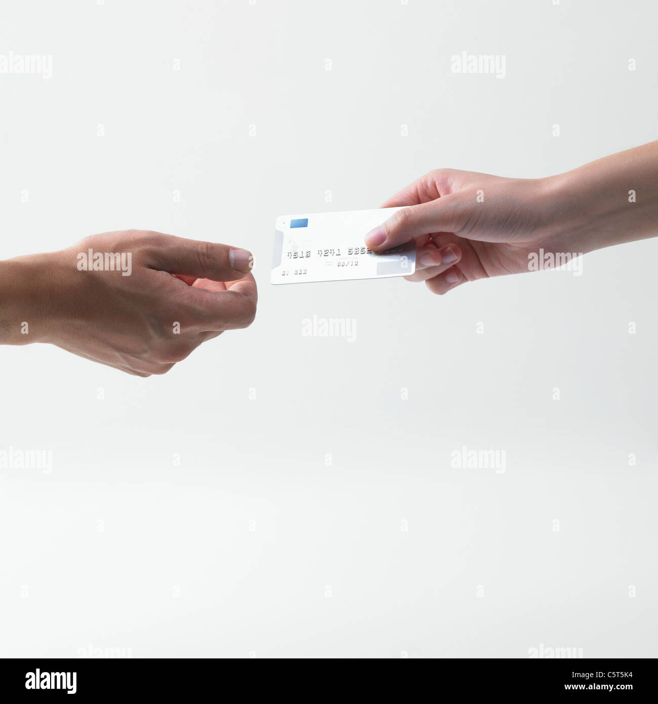 A person giving a credit card to other person Stock Photo - Alamy