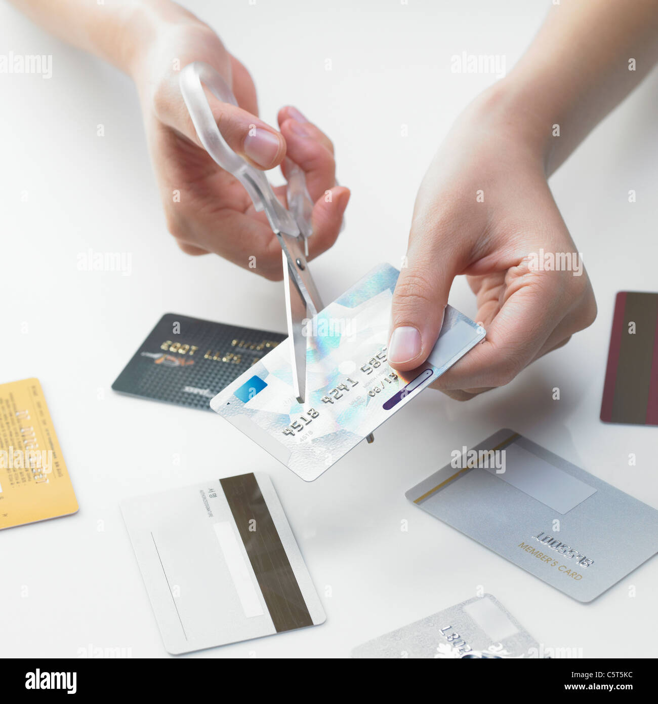 Cutting card with scissors hi-res stock photography and images - Alamy