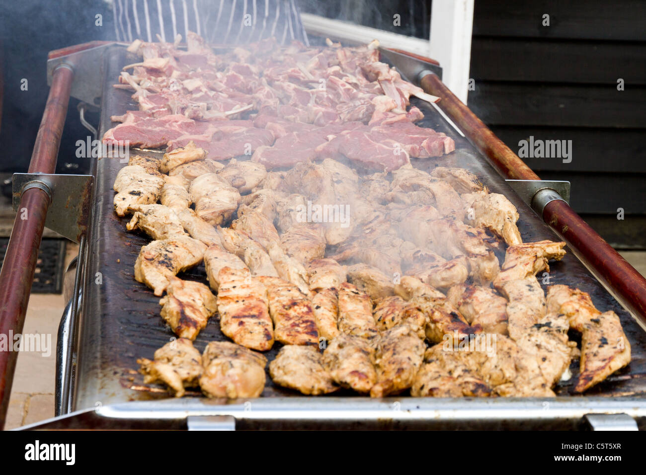 Catering barbecue various meats Stock Photo - Alamy