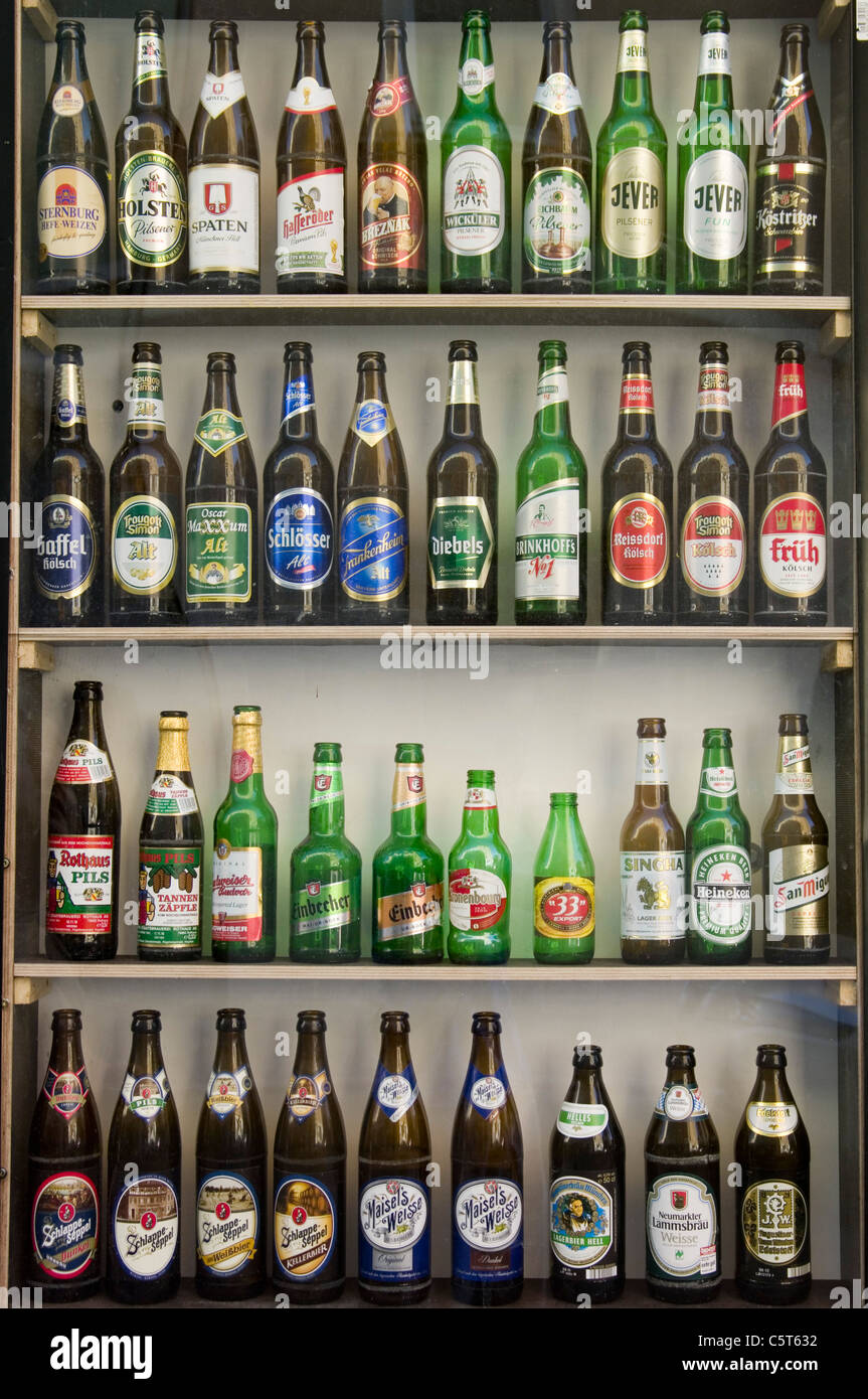 Germany, Hesse, Frankfurt, Variety of beer bottles placed in shelf ...