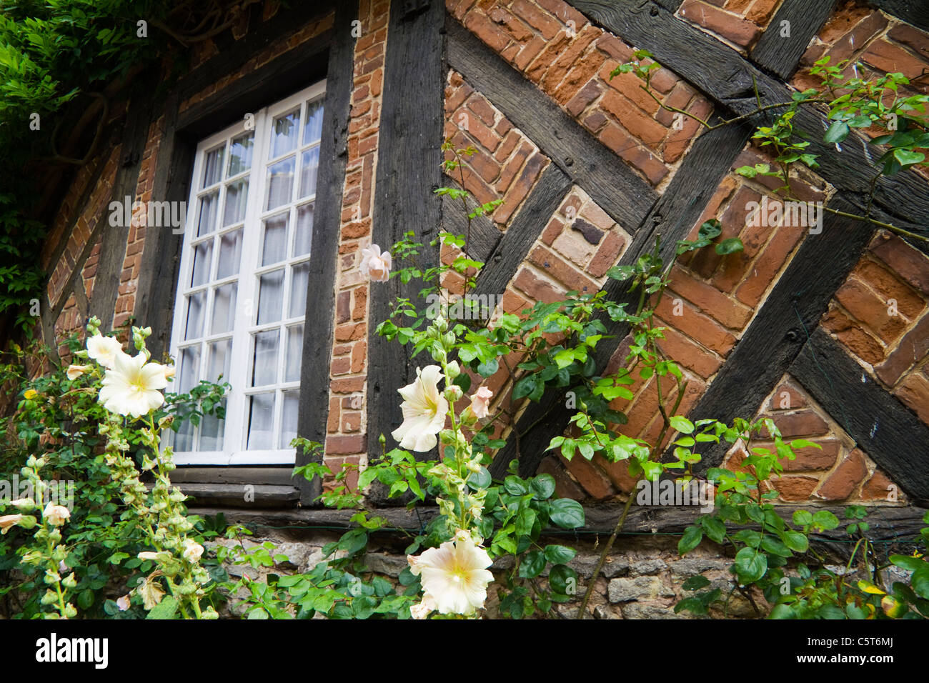Stone and timber wall of an old house in Gerberoy Village, Picardie ...