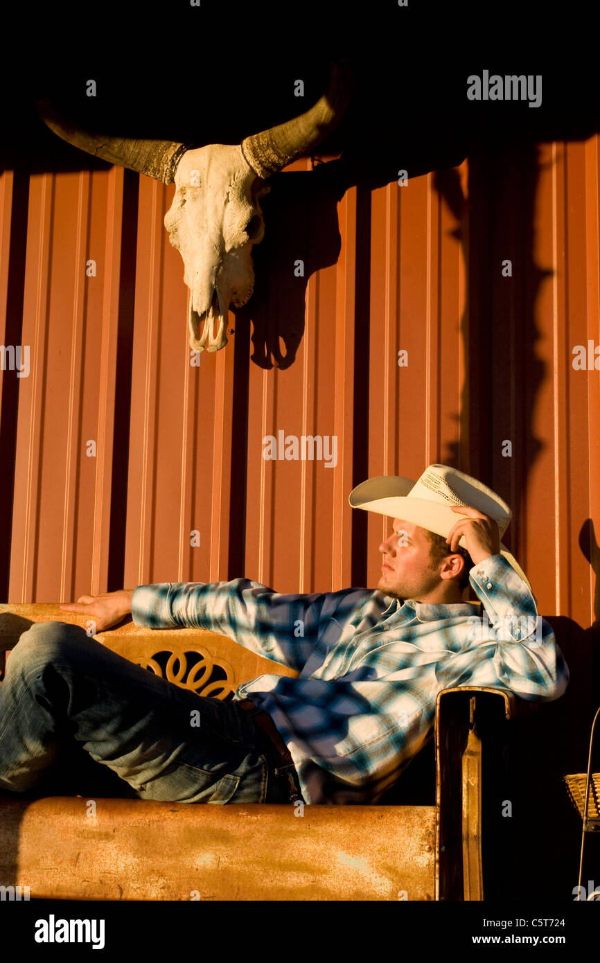 USA, Texas, Dallas, Cowboy sitting on Veranda Stock Photo - Alamy