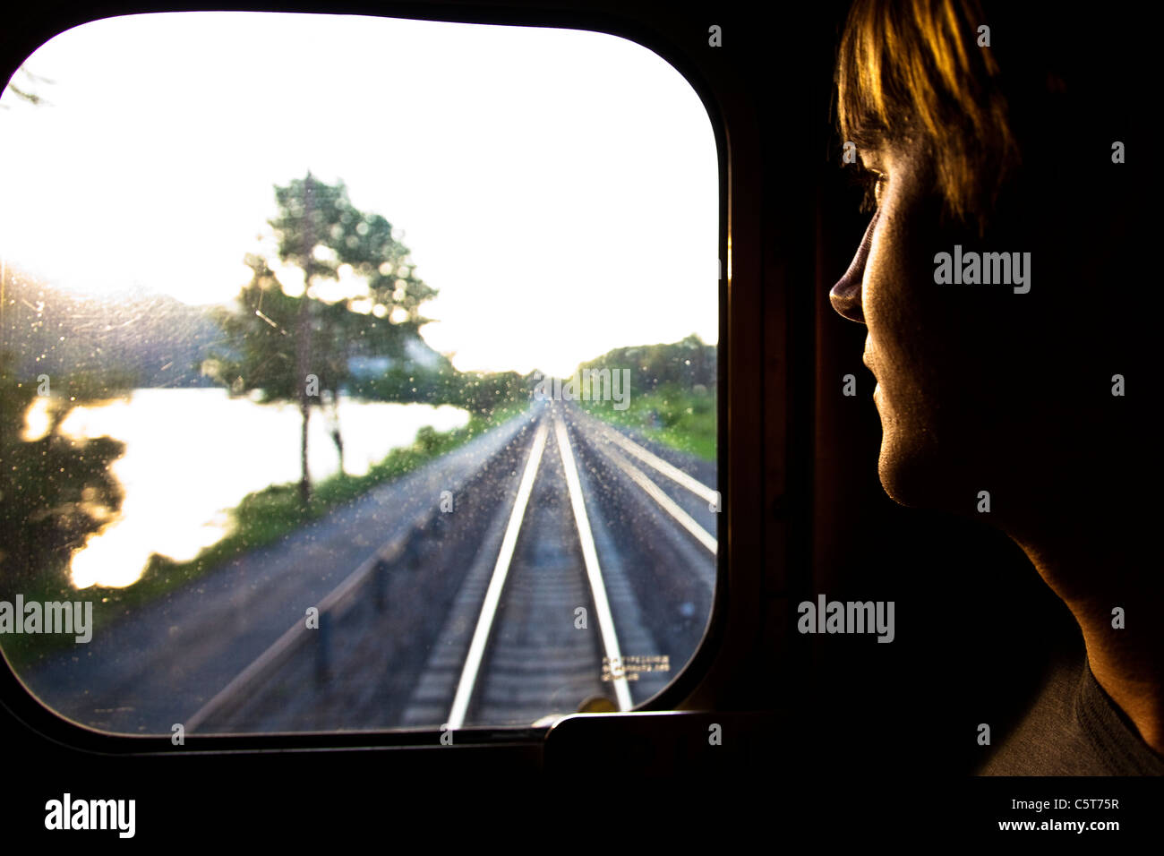 Passenger looking out the back window of an Amtrak train in New York ...