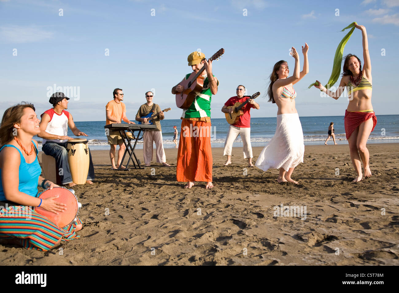Spain, Canary Islands, Gran Canaria, Young people celebrating on beach ...