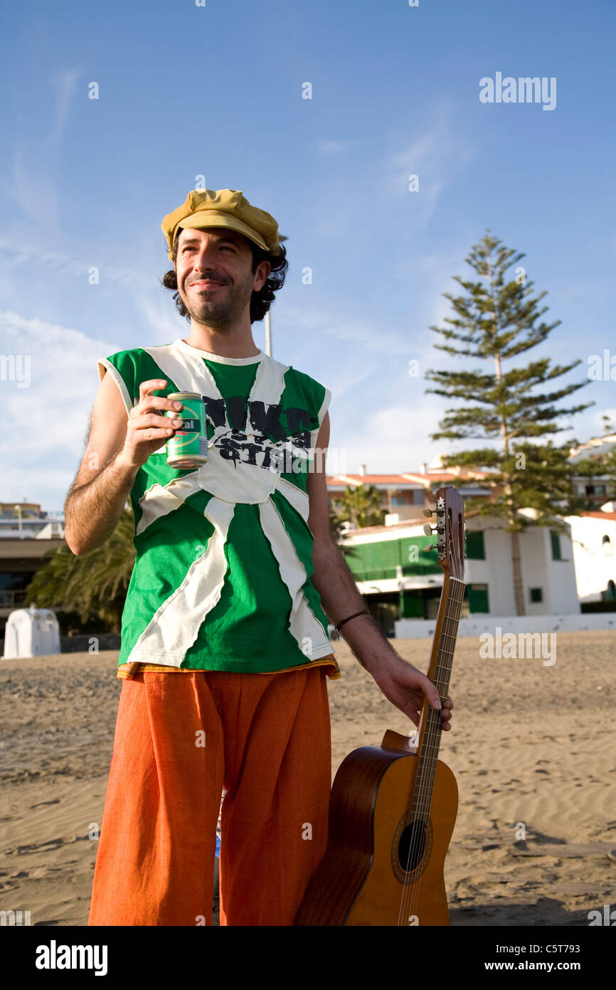 Spain, Canary Islands, Gran Canaria, Young man with guitar Stock Photo ...