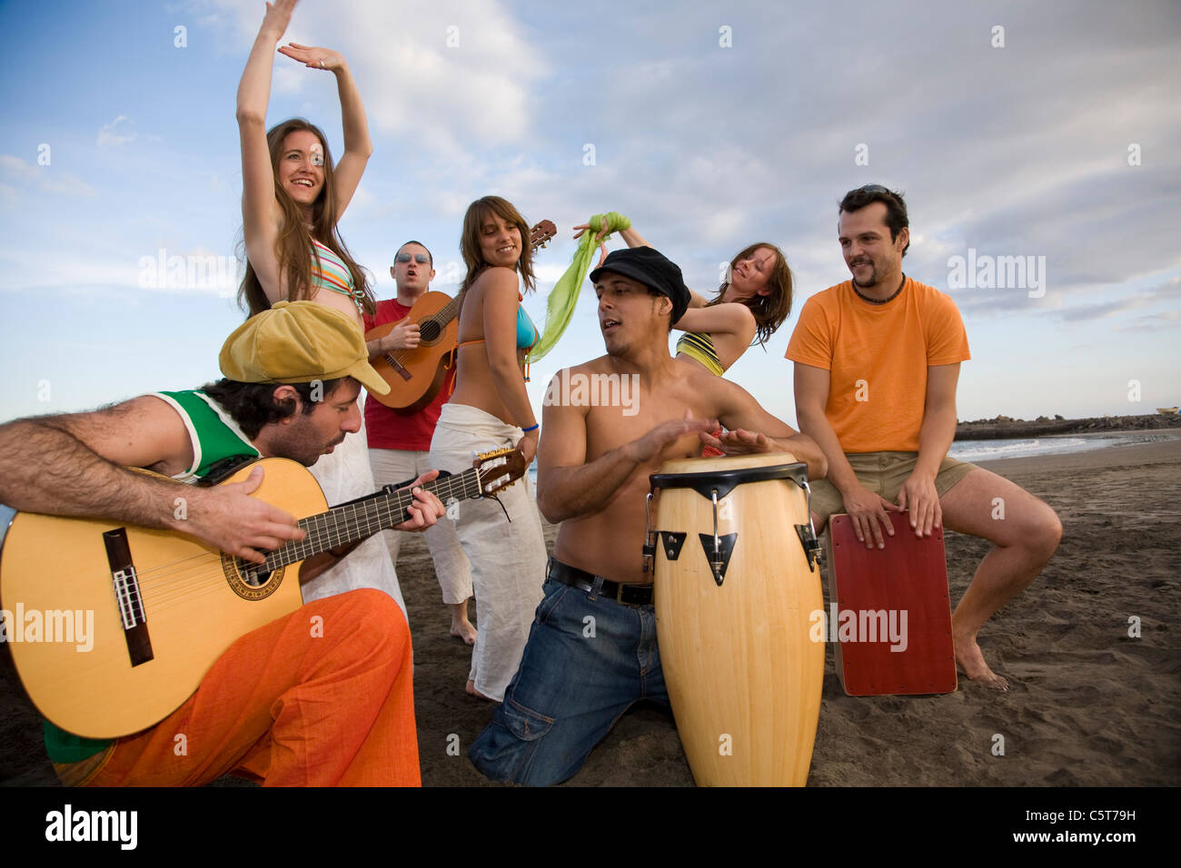 Spain, Canary Islands, Gran Canaria, Women dancing, Man with bongo drum ...