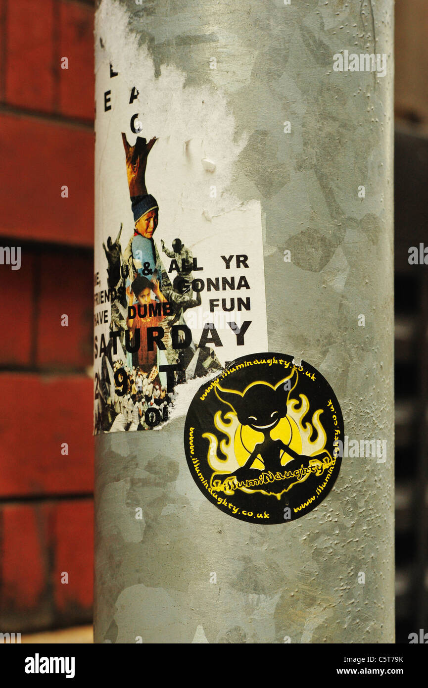 Stickers on Sign Post Stock Photo - Alamy