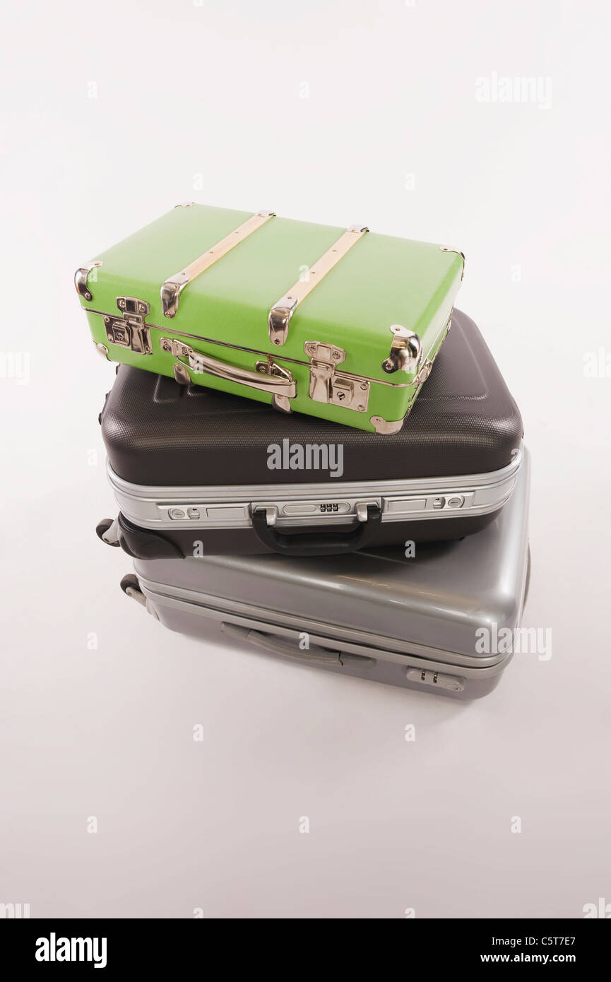 Stack of suitcases and luggages against white background Stock Photo ...