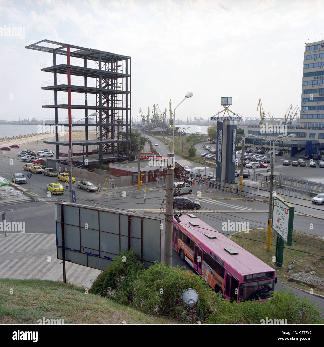 Romania, Constanta, View of city with bus and construction building ...