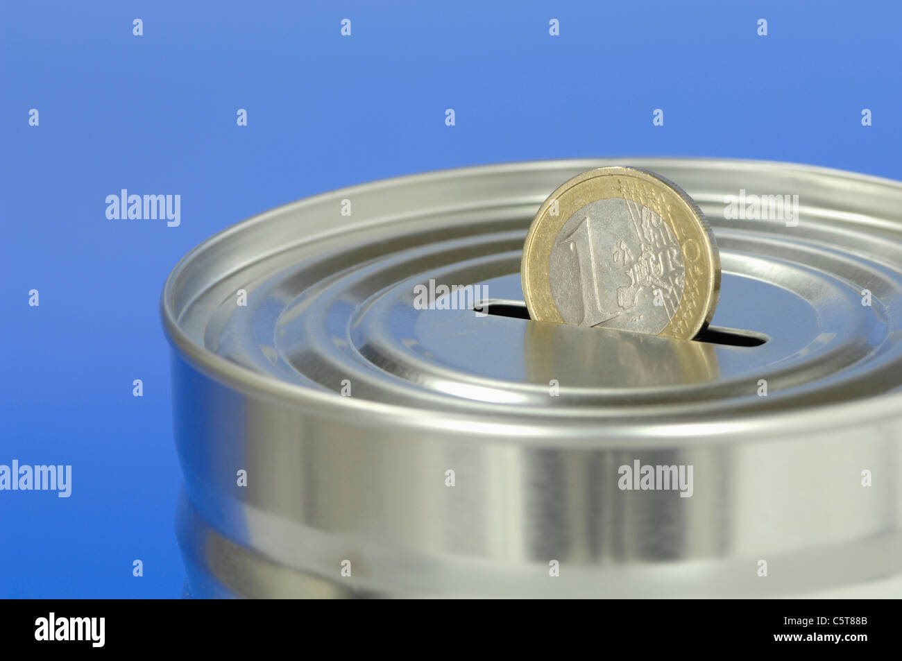 Money box with Euro coin Stock Photo - Alamy