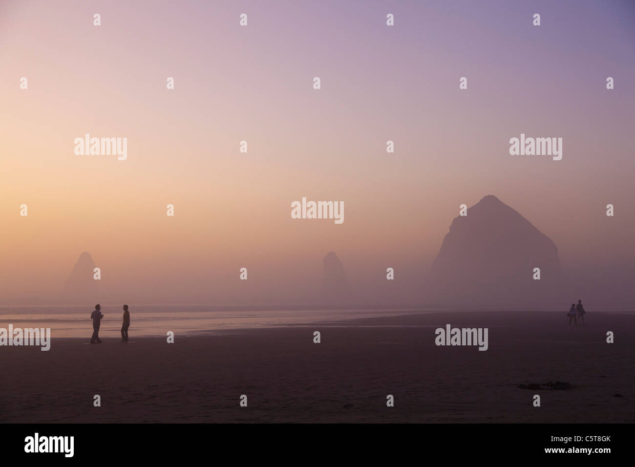 Cannon Beach and Haystack Rock at Sunset Oregon USA Stock Photo - Alamy
