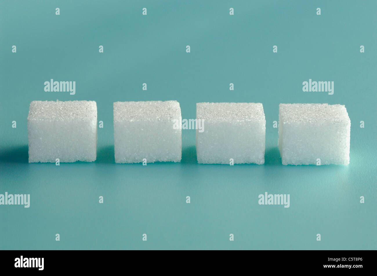 Sugar cubes in a row Stock Photo - Alamy