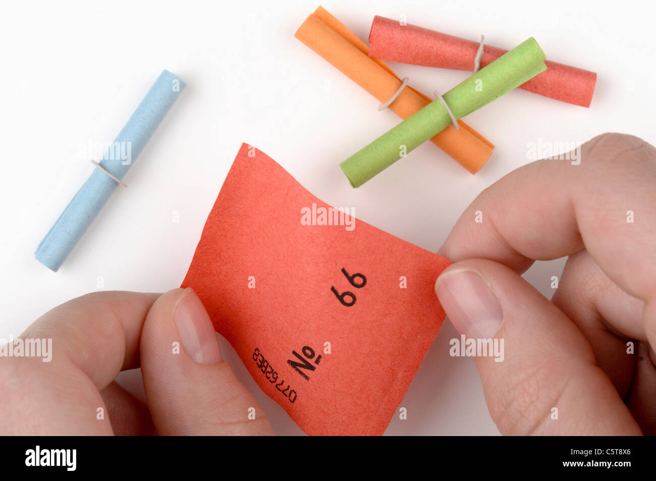 Person holding lottery ticket, close-up Stock Photo - Alamy