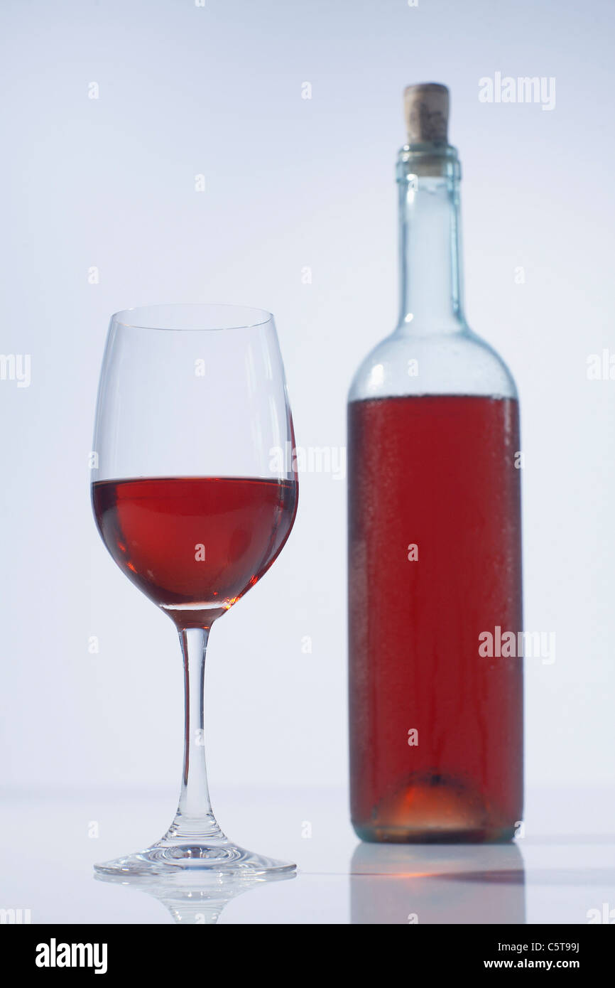 Rose wine bottle and glass of rose wine Stock Photo - Alamy