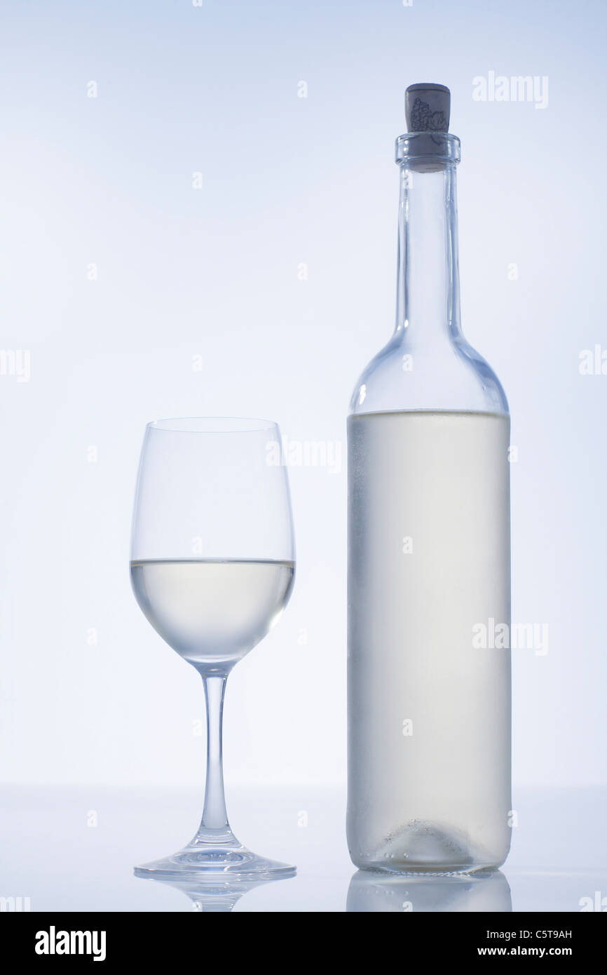 Bottle of white wine and glass of white wine Stock Photo - Alamy