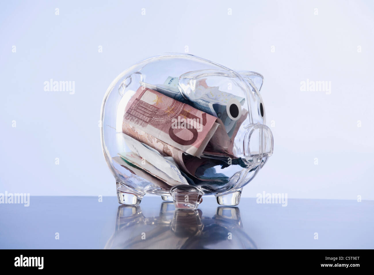 Money in piggy bank Stock Photo - Alamy