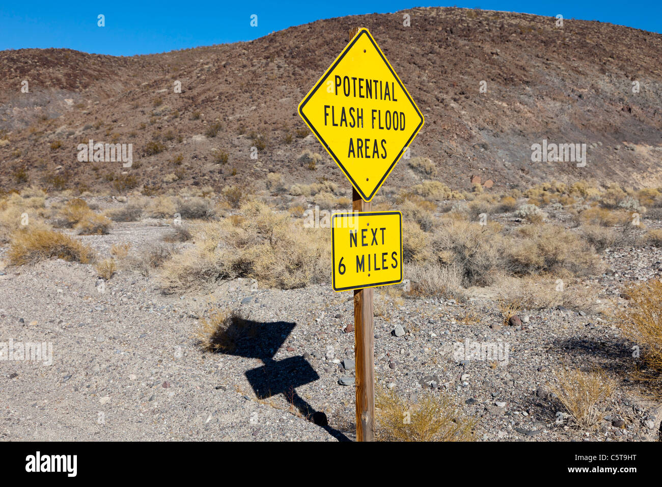 Warning sign for flash floods in desert Death Valley USA Stock Photo ...