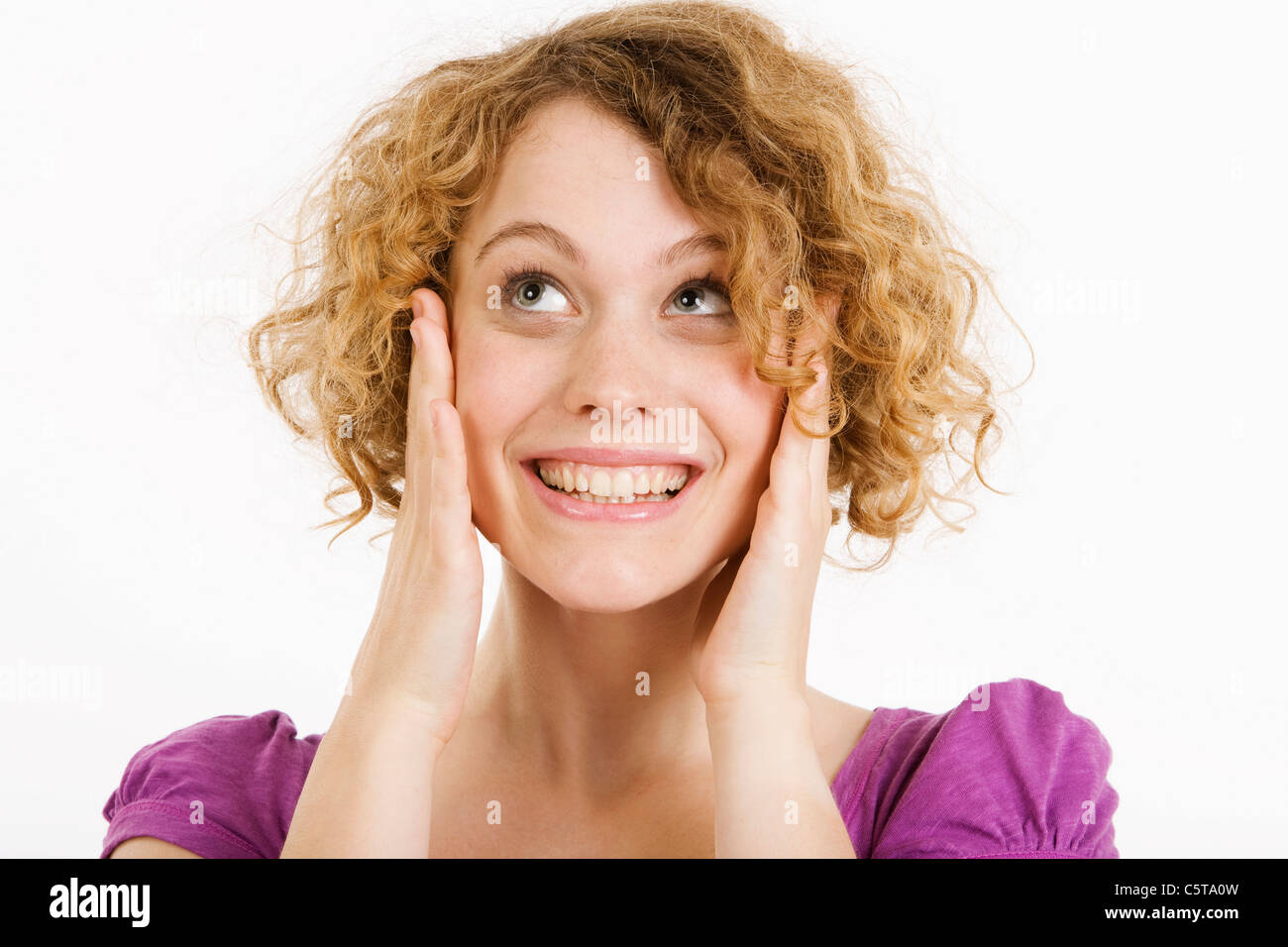 Young woman hands on chin, portrait Stock Photo - Alamy