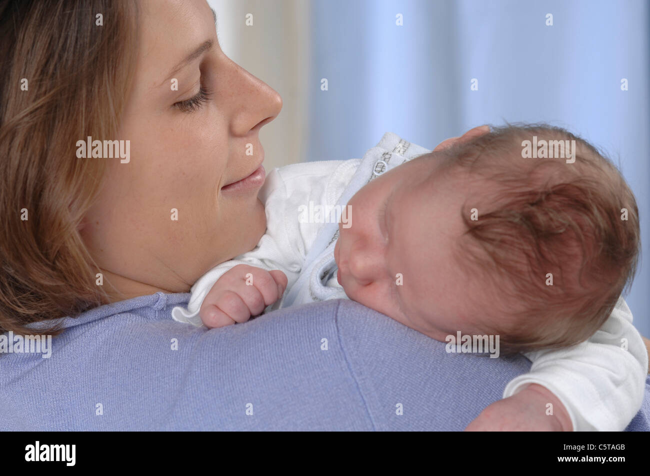 Germany, Bavaria, Munich, Mother with newborn (3 weeks), close up Stock ...