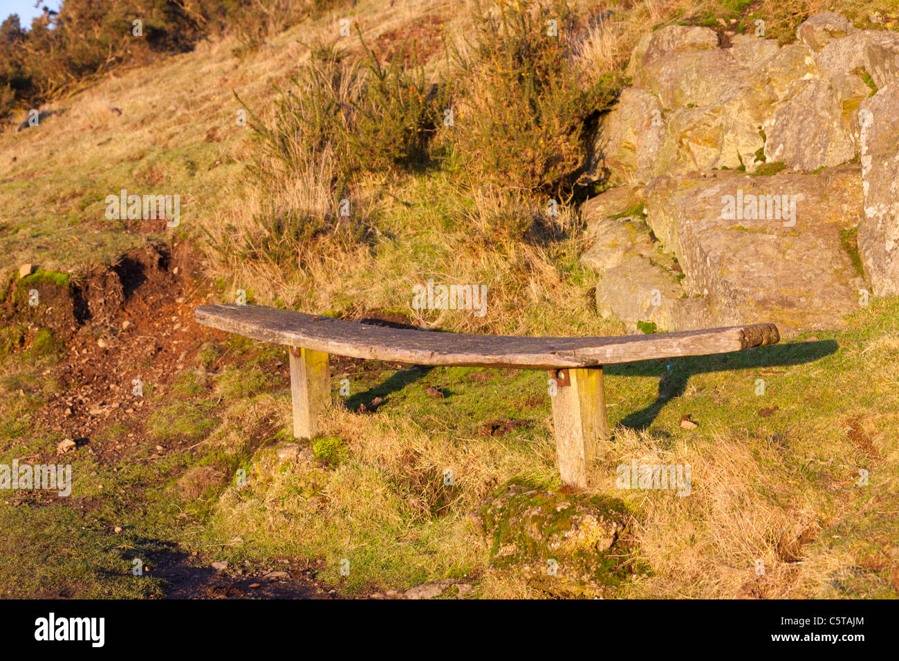 Wooden bench in countryside Stock Photo - Alamy