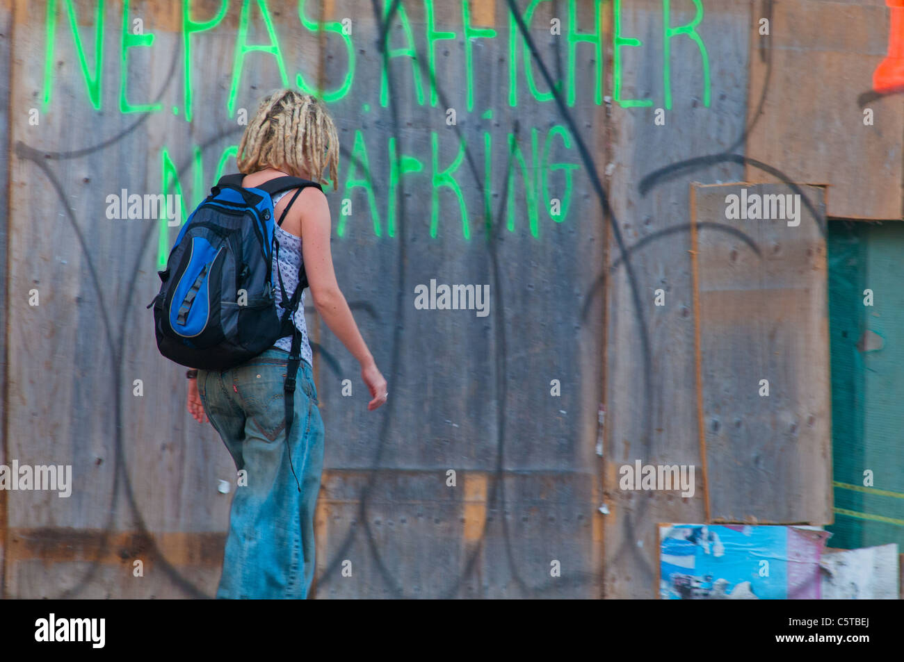 Person walking in front of graffiti Stock Photo - Alamy