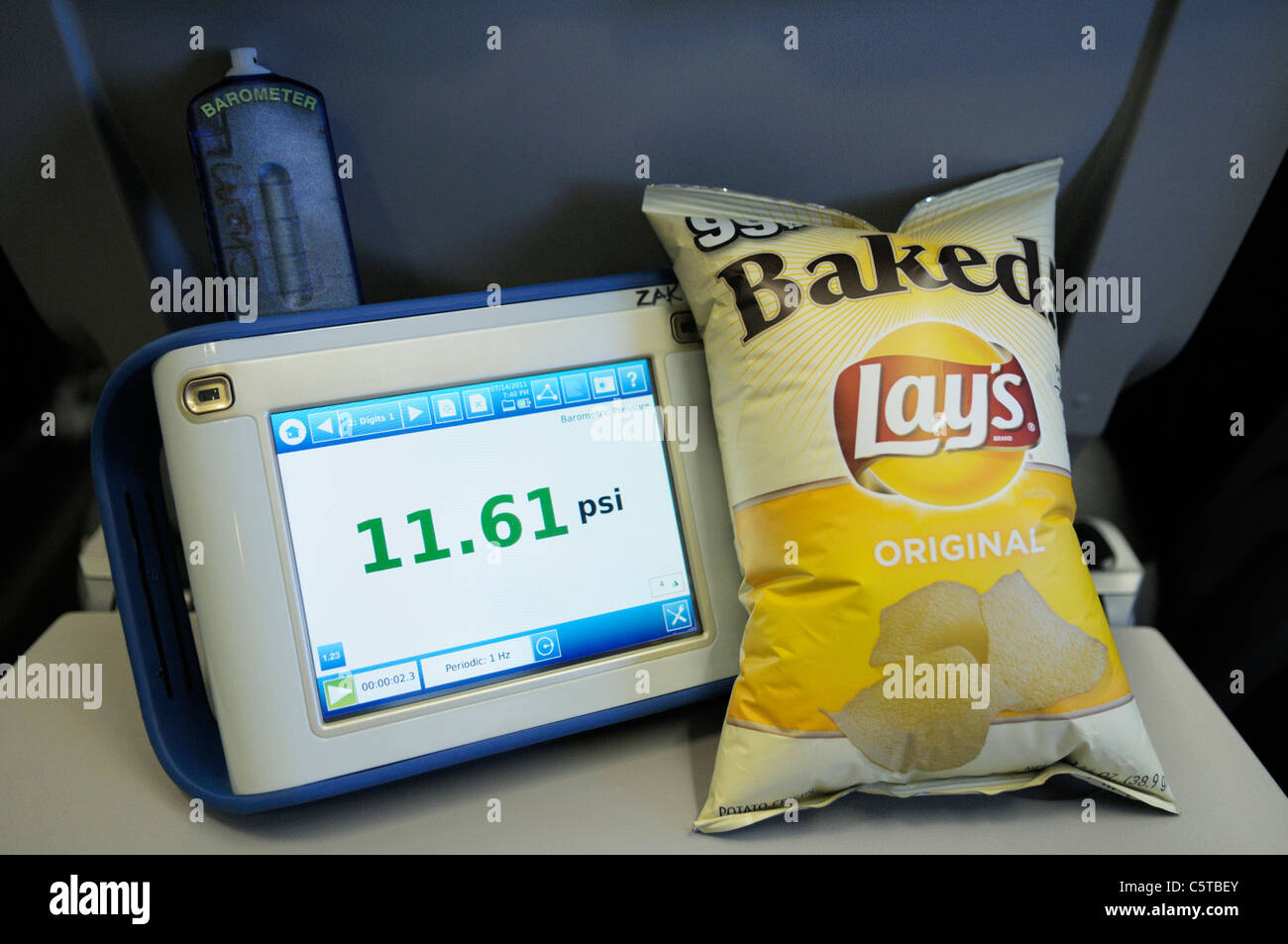 Chip bag puffed up because of lower atmospheric pressure at high ...
