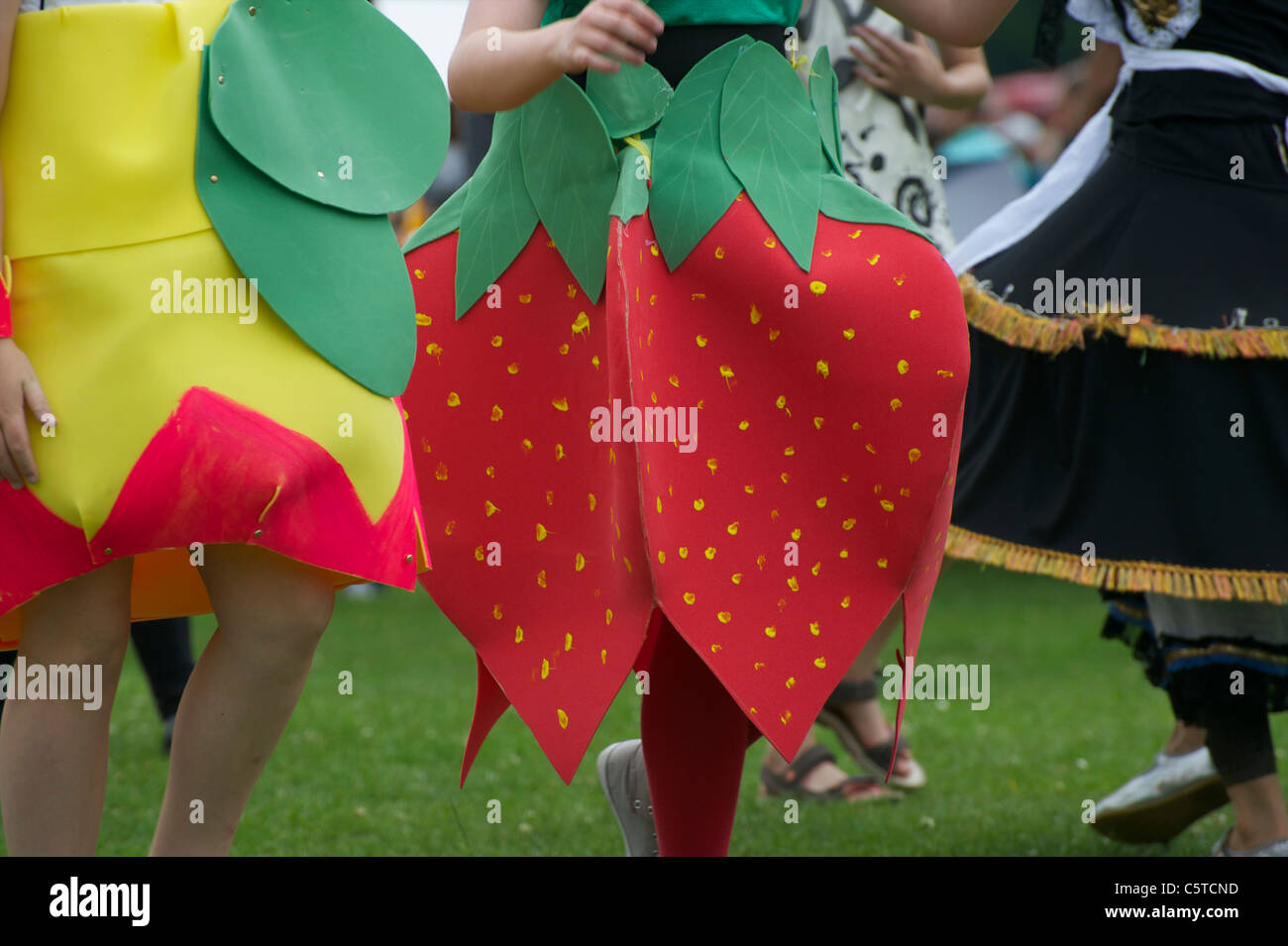 Strawberry costumes at a carnival parade Stock Photo - Alamy