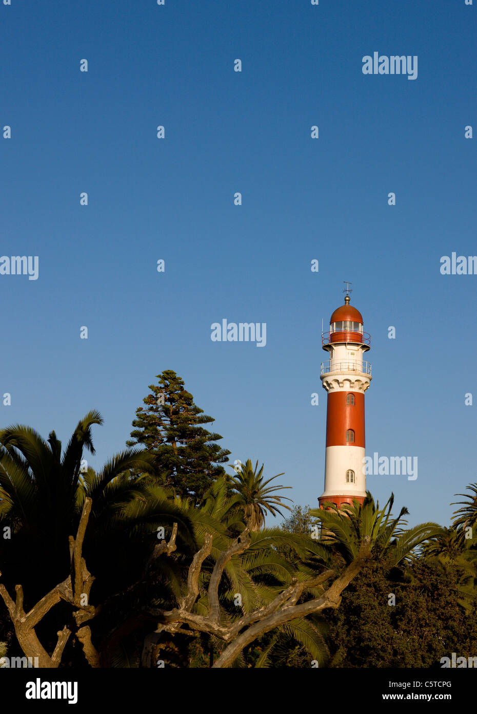 The lighthouse towers above the palm trees. Swakopmund, Namibia Stock ...
