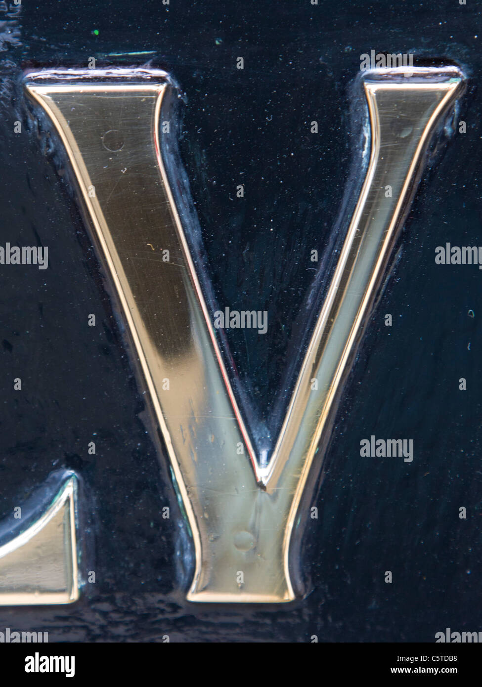 Character V character letter photograph brass Stock Photo - Alamy