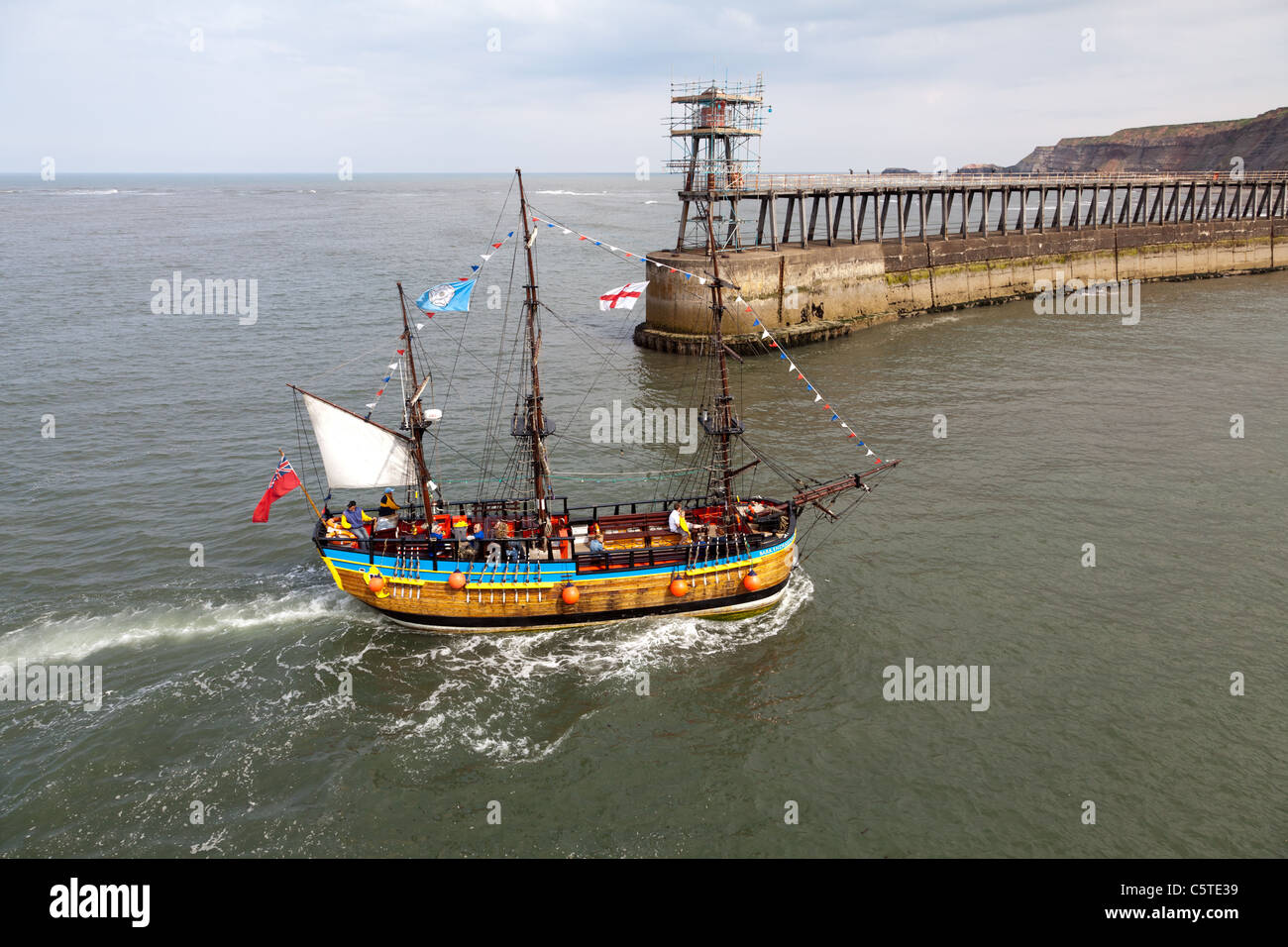 The Endeavour entering Whitby harbour,Whitby, North Yorkshire Stock ...