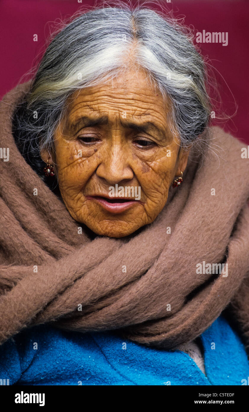 Portrait of an old gray haired indian woman at the Otavallo market in ...
