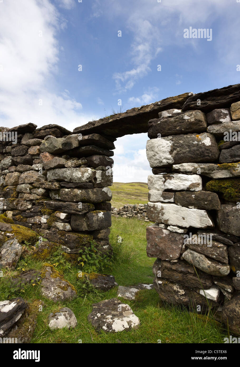 Stone doorway of ruined old croft building, Boreraig, Isle of Skye ...