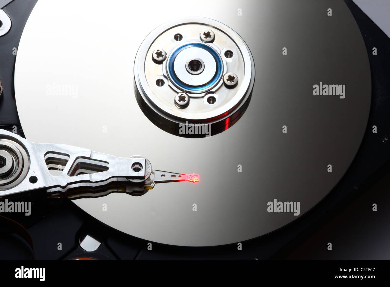 Computer hard drive, opened, reading/writing head and hard disk Stock Photo - Alamy