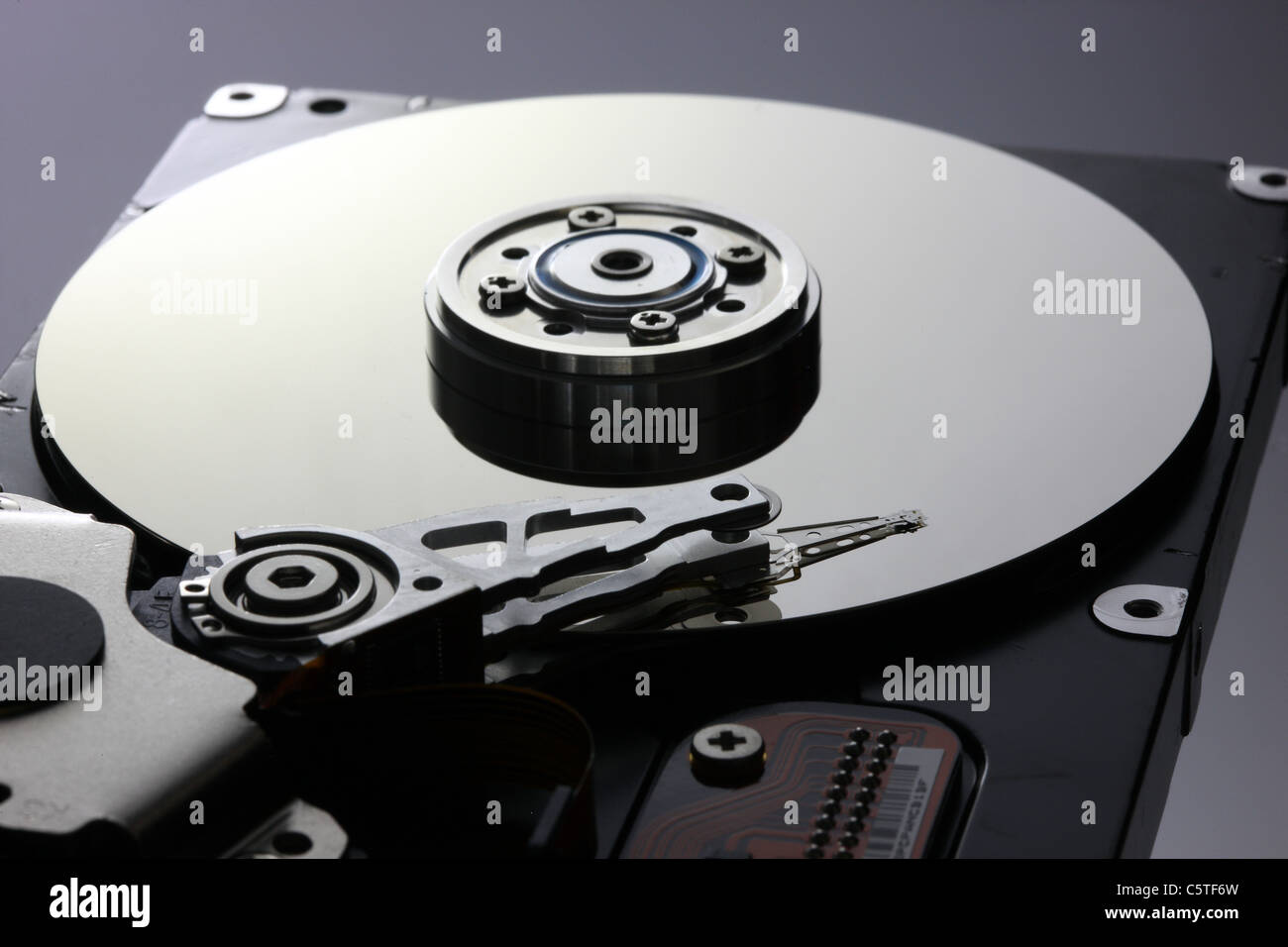 Computer hard drive, opened, reading/writing head and hard disk Stock Photo - Alamy