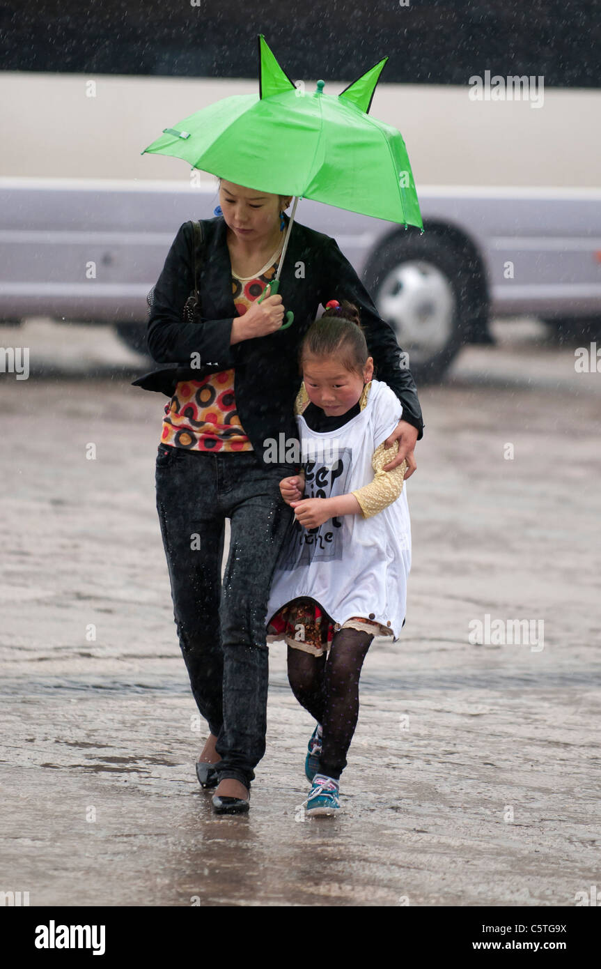 Child china rain hi-res stock photography and images - Alamy