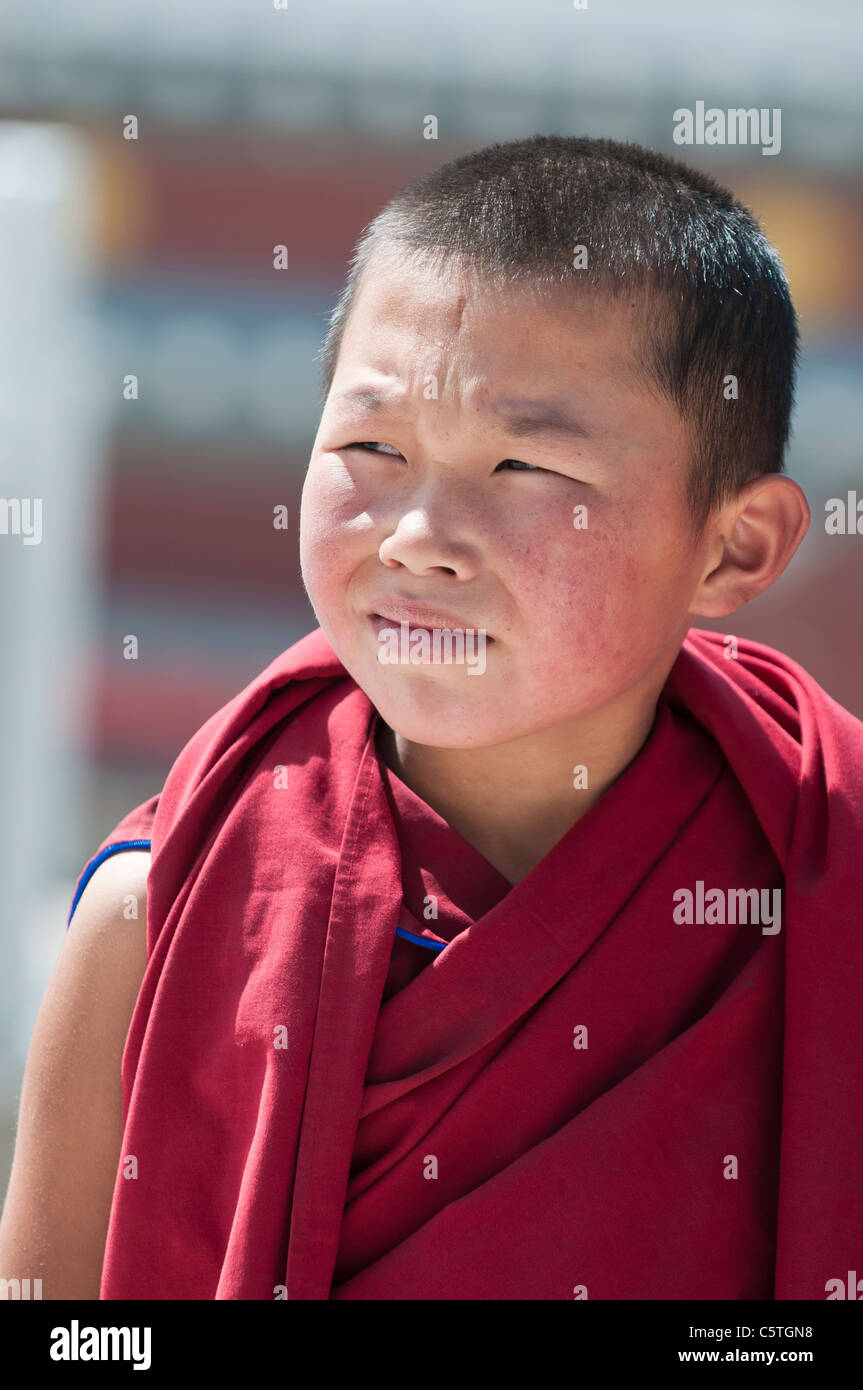 Young boy is Tibetan Buddhist monk at Dulan Monastery, Ulan, Qinghai ...