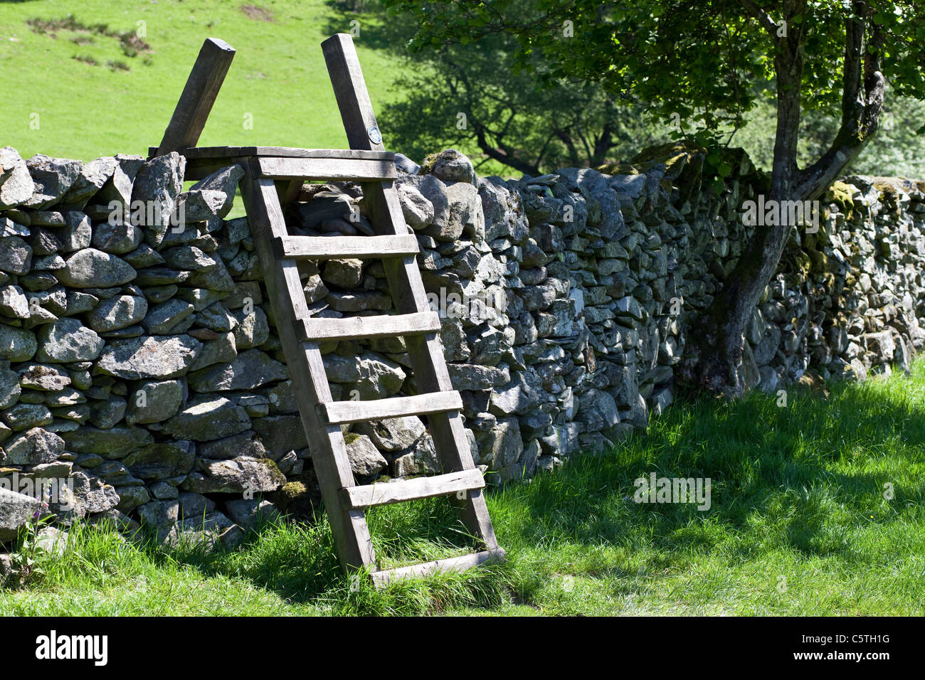 Stile in the Lake District over a dry stone wall Stock Photo - Alamy