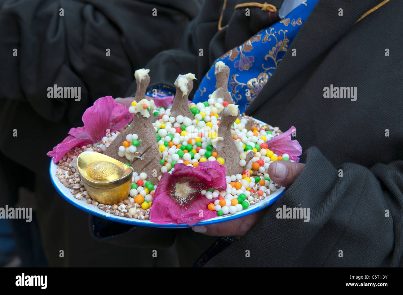 Village elders bring tsampa and other food offerings at shaman harvest ...