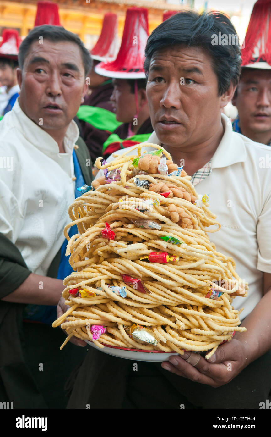 Village elders bring food offerings at shaman harvest festival, Tongren ...
