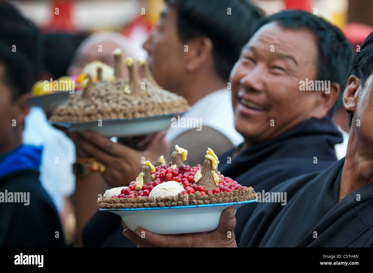 Village elders bring tsampa and other food offerings at shaman harvest ...