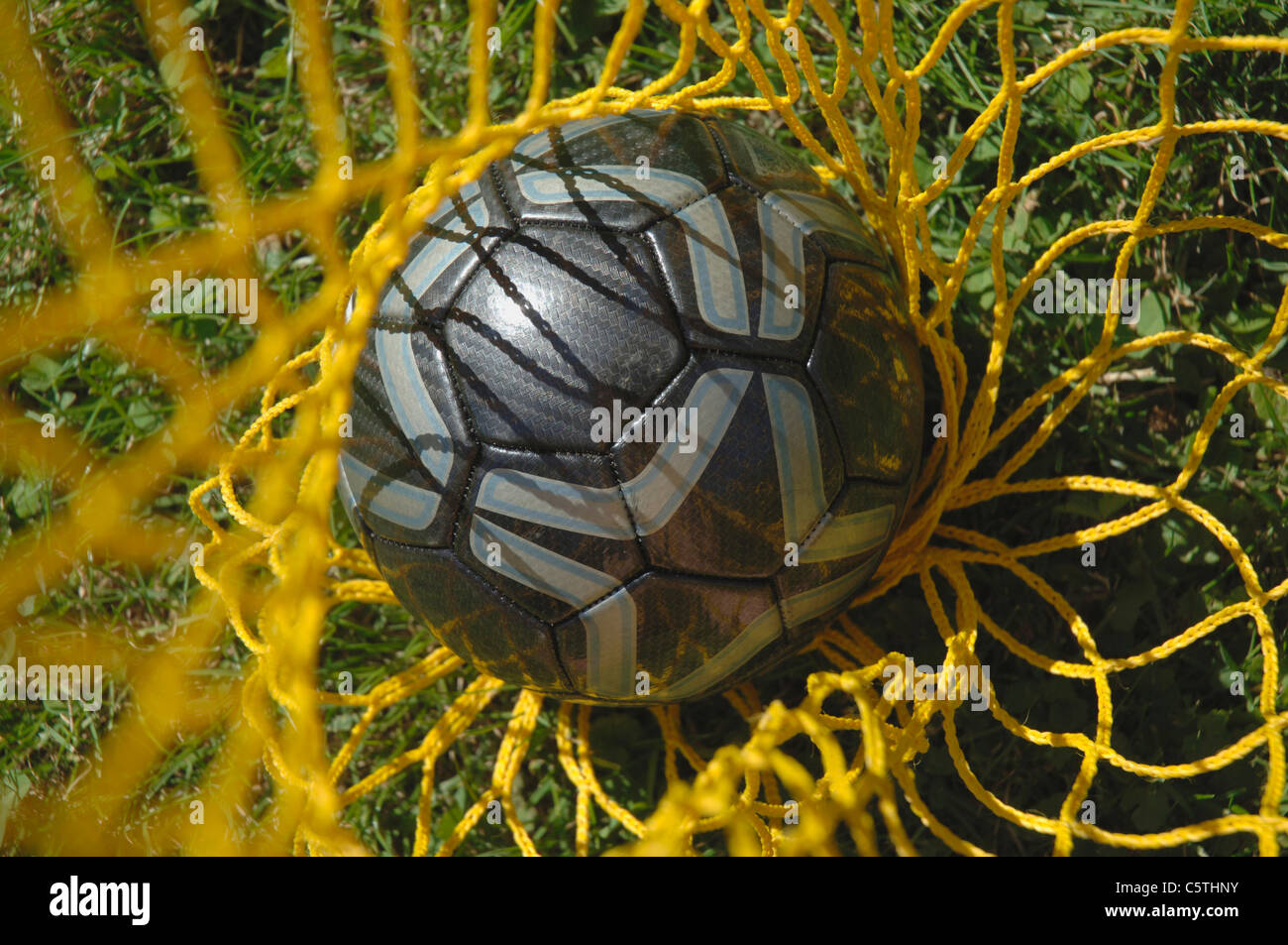 Soccer ball in net hi-res stock photography and images - Alamy
