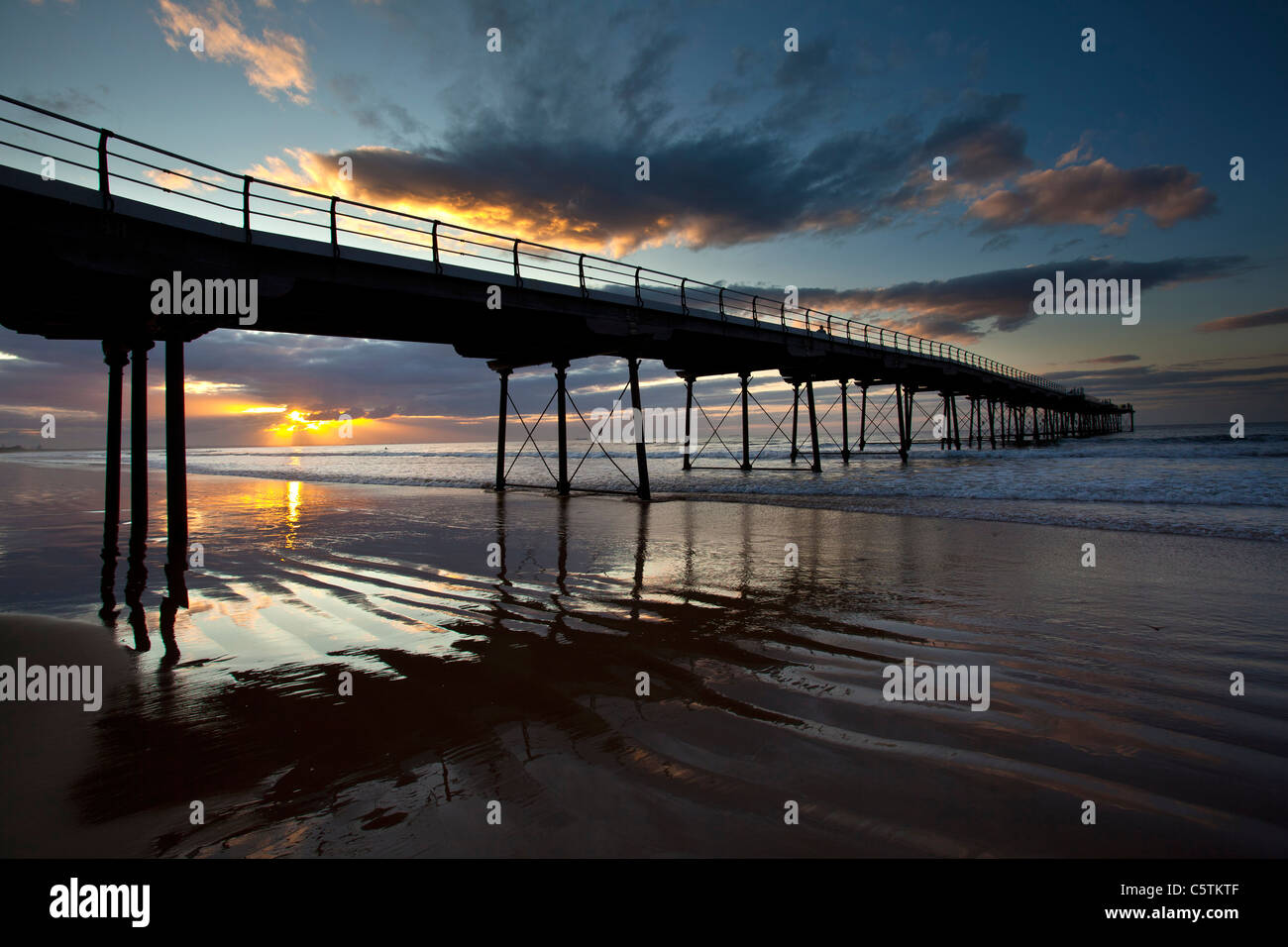 Summer sunset through Saltburn Pier, Cleveland Stock Photo - Alamy