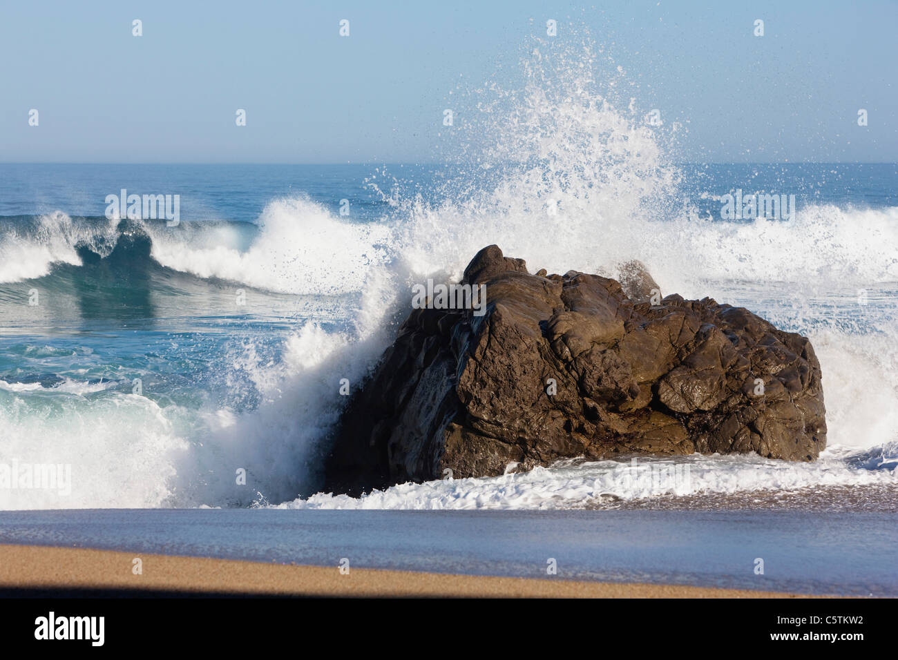 USA, California, Waves crushing on rock Stock Photo - Alamy