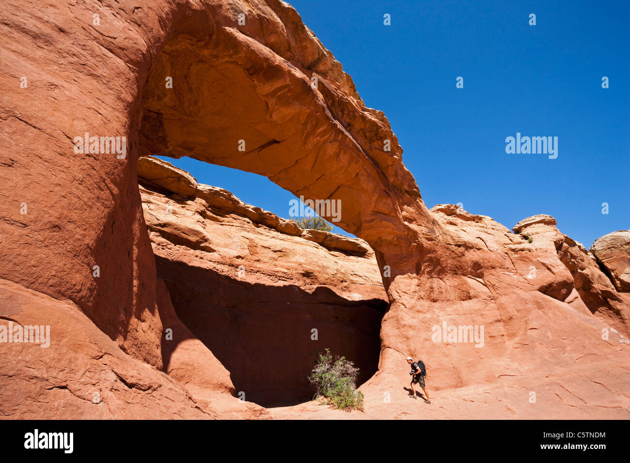 Hiker in arch arches hi-res stock photography and images - Alamy