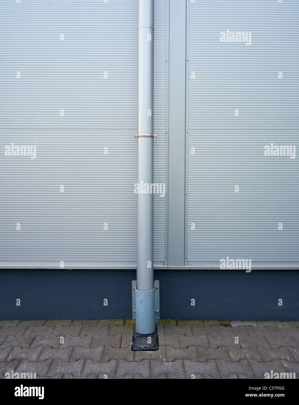 Part of exterior of a warehouse, metal gutter and wall. Modern look ...