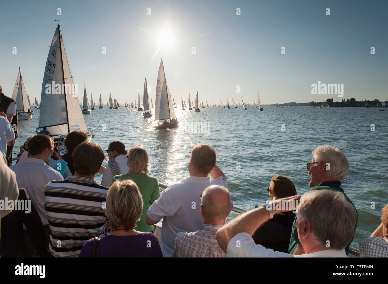 Woman watching sailing boats hi-res stock photography and images - Alamy