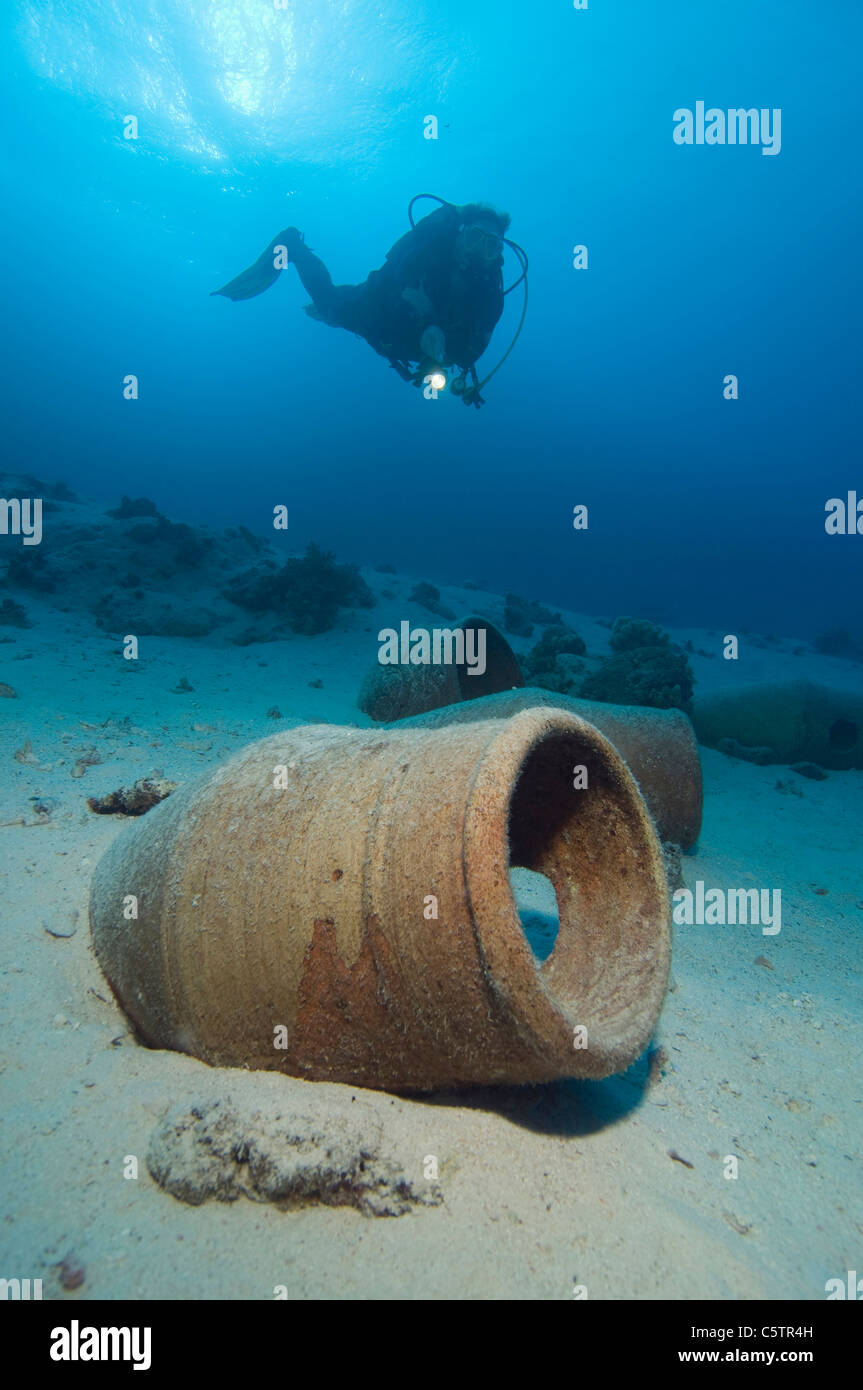 Egypt, Red Sea, Scuba diver and amphoras on ocean bed Stock Photo - Alamy